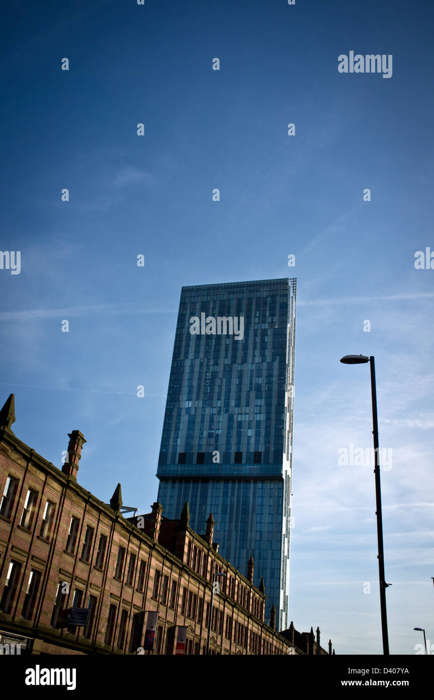 Street view of Manchester Hilton Tower enveloped in clear blue sky ...