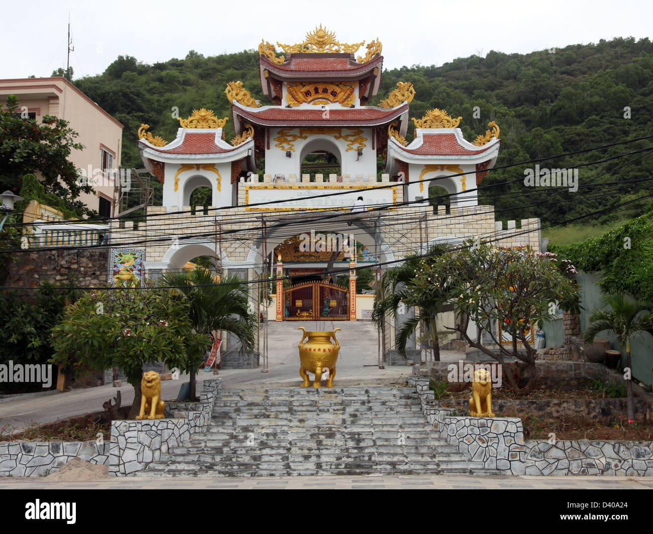 It's a photo of a Chinese Temple that is on a rock in nature. We can ...