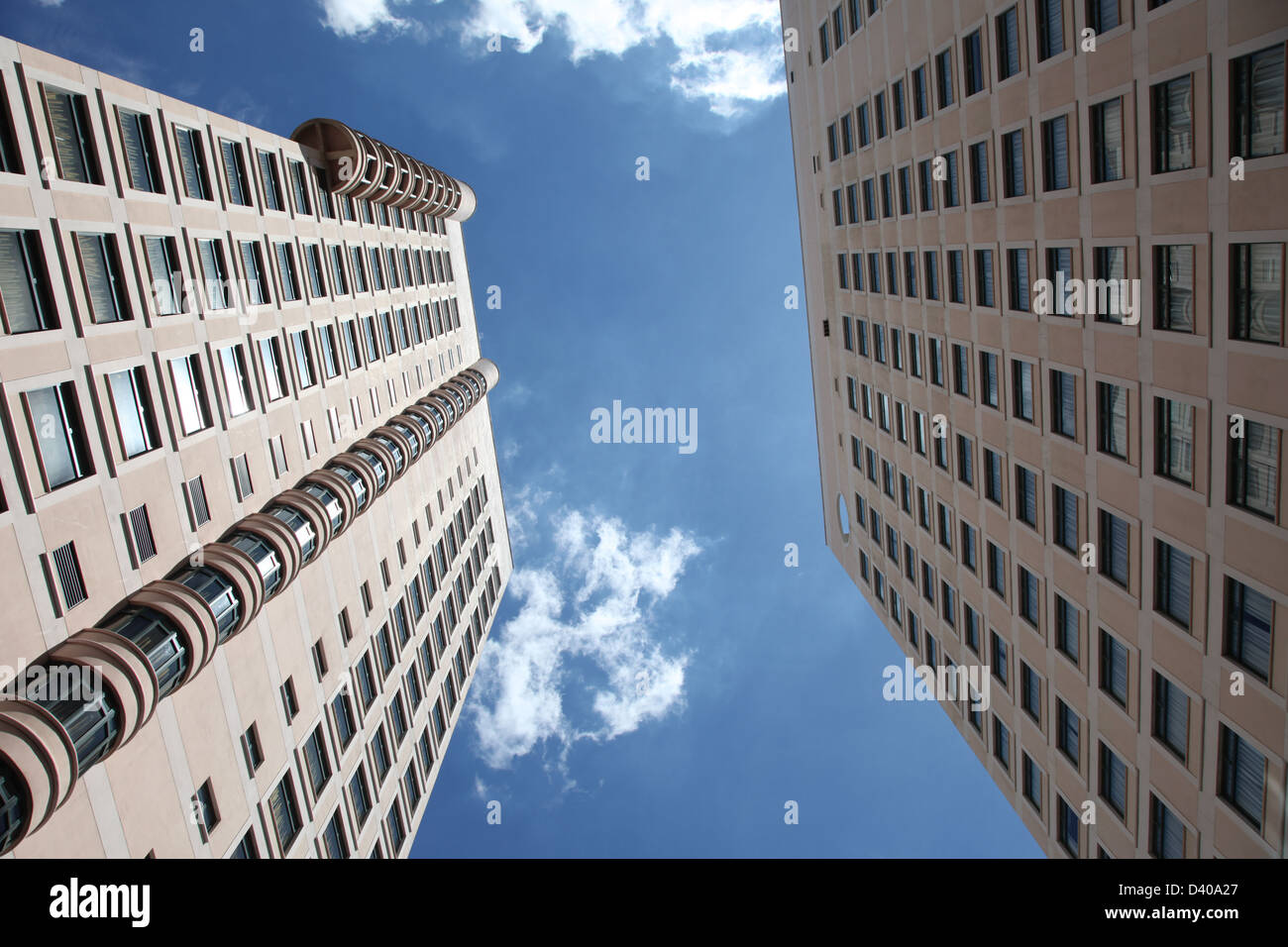 It's a photo of a tower building view from underneath. It is in ...