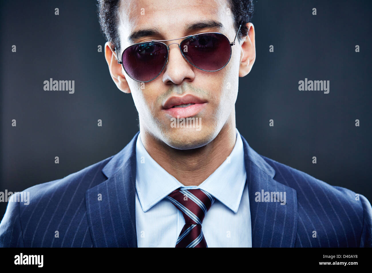 Portrait of calm man in sunglasses looking at camera Stock Photo - Alamy