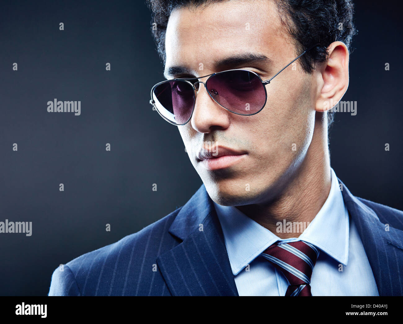 Portrait of calm man in sunglasses posing for camera Stock Photo - Alamy