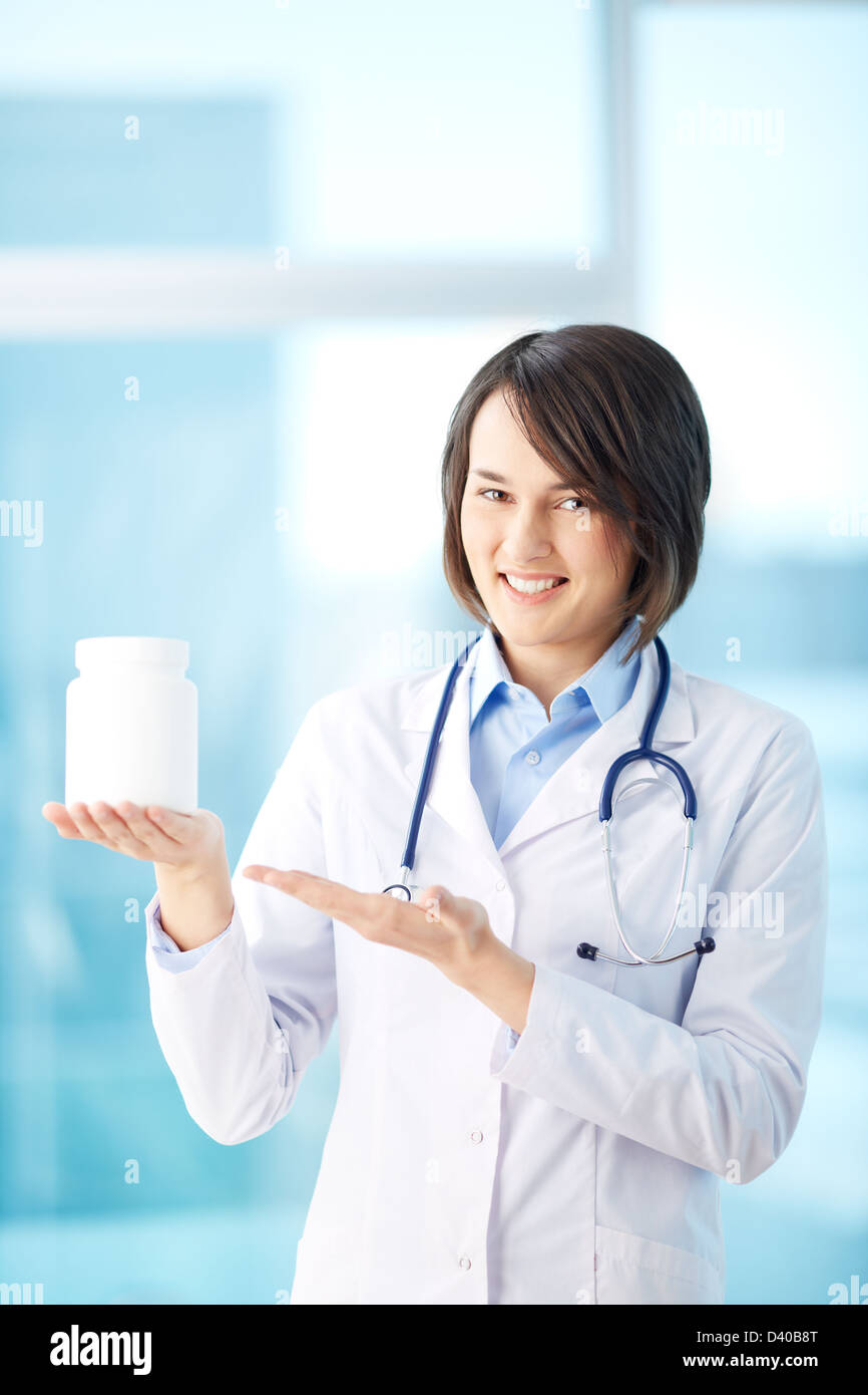 Portrait of a female doctor presenting new pills Stock Photo - Alamy