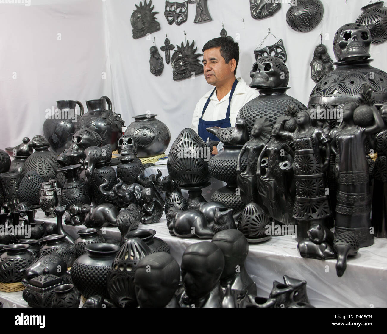 Mexican man selling black pottery, barro negro, in Queretaro Mexico ...
