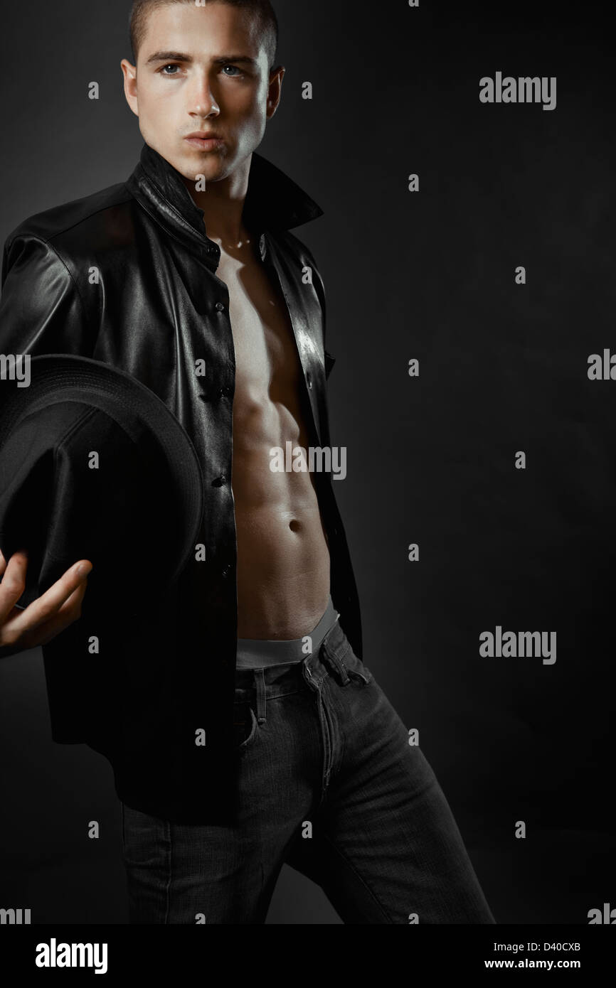Young caucasian man in men's fashion photo taken in studio Stock Photo ...
