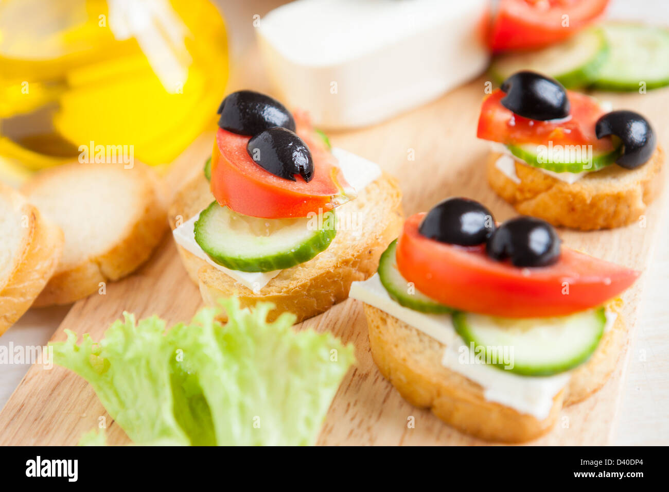 small canapés with feta and vegetables, closeup Stock Photo - Alamy