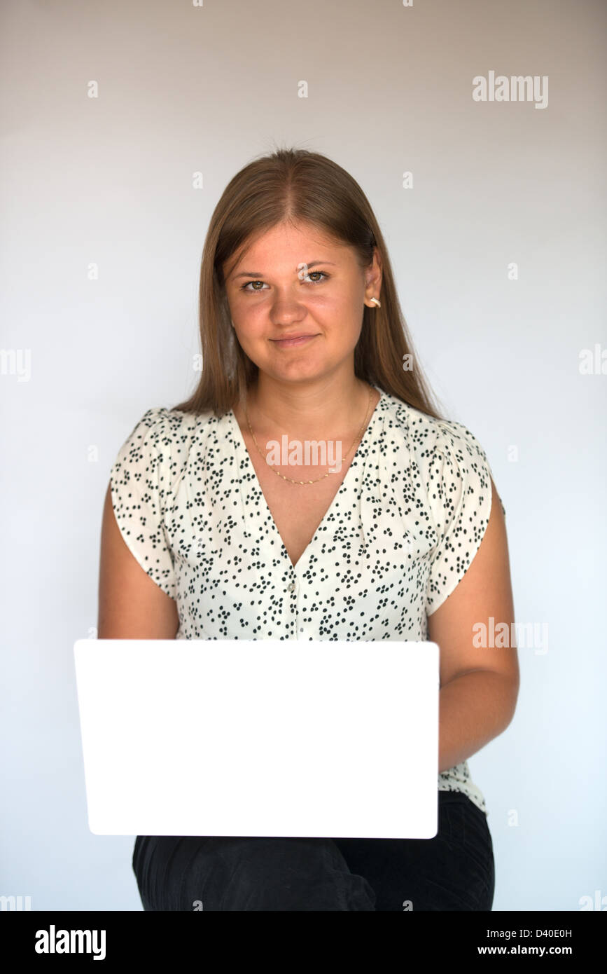 pretty blond girl with white laptop computer Stock Photo - Alamy