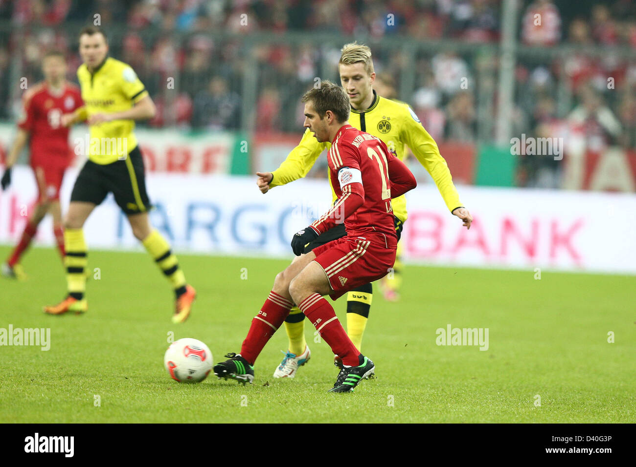 Munich, Germany. 27th February 2013. Dortmund's Marco Reus (back) vies ...