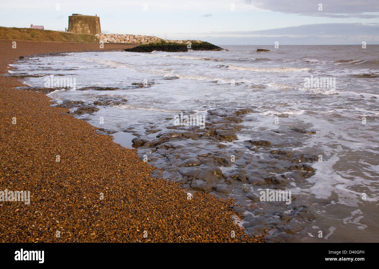 London Clay wave cut platform exposed at low tide on the beach at East ...