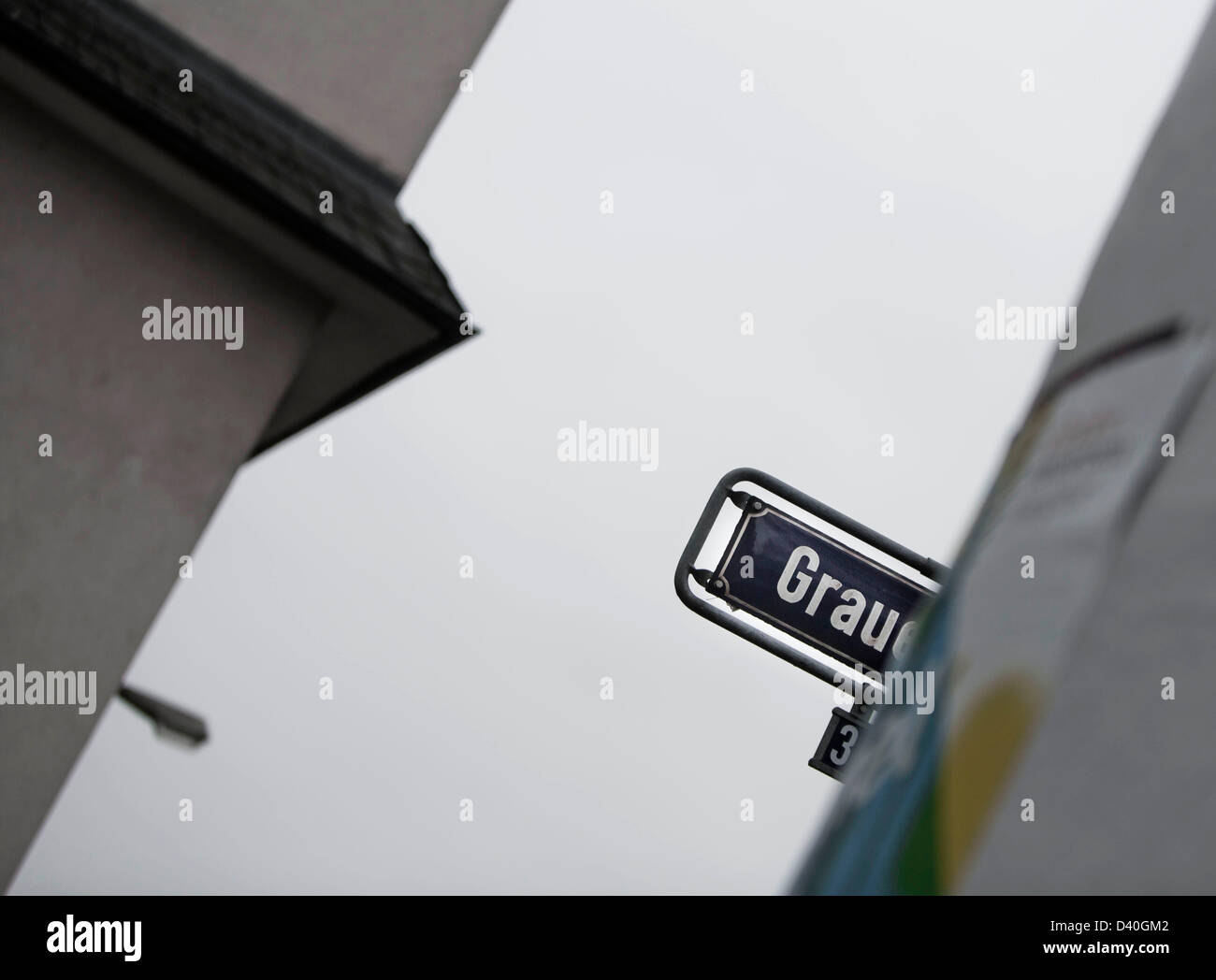 The word 'Grau' ('Grey') stands on a road sign 'Grauer Stein' in front ...