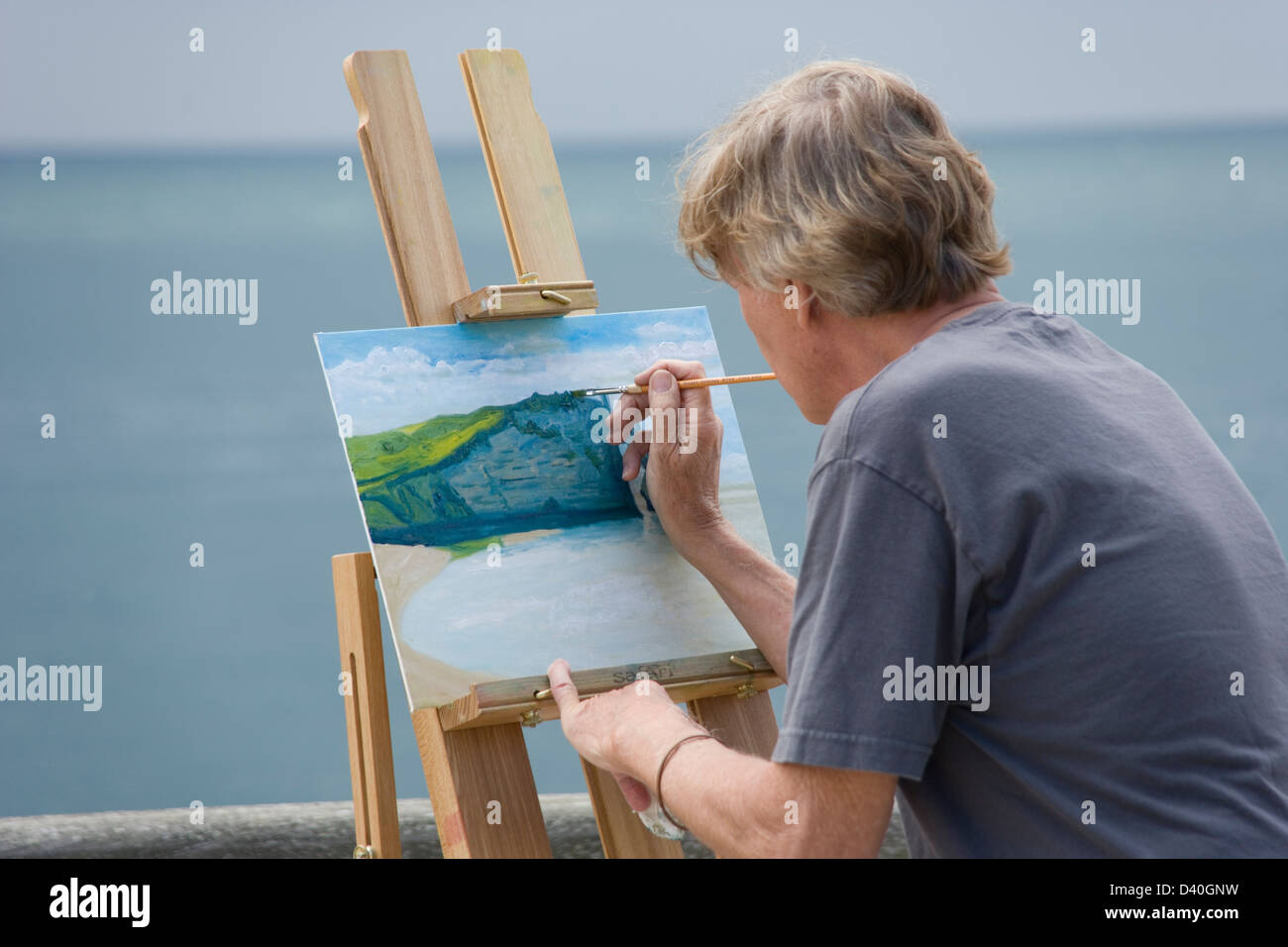 Artist painting on the promenade at Etretat in Normandy France Stock ...