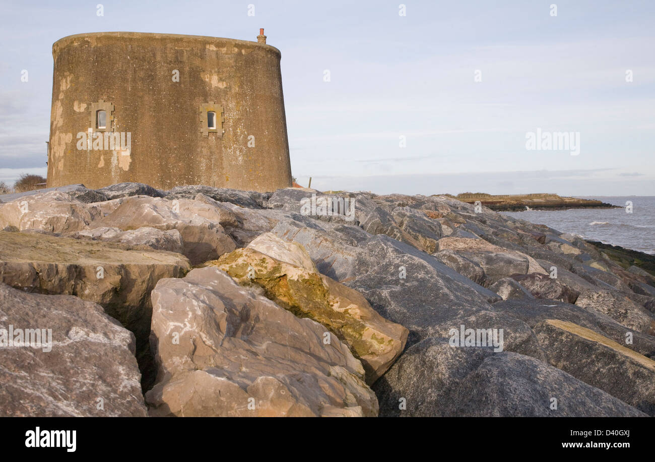 Martello tower defended from erosion by rock armour at East Lane ...