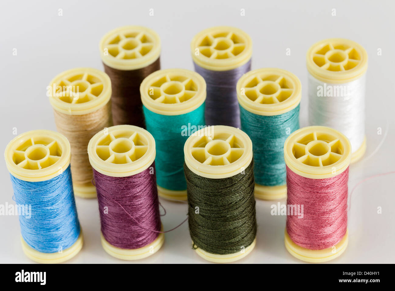 Colorful thread bobbins Stock Photo - Alamy