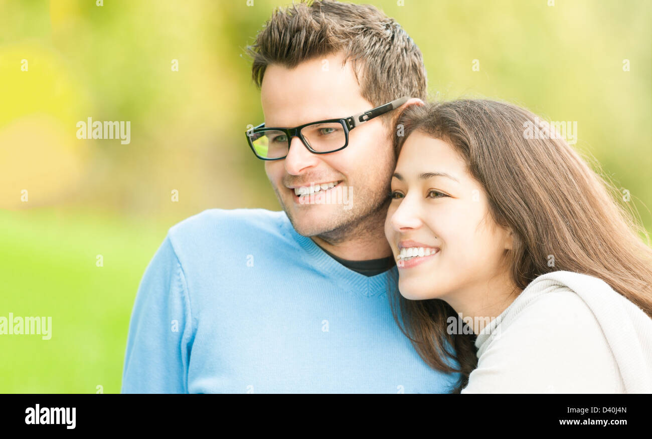 Portrait of beautiful romantic couple. People dating in park. Pretty ...