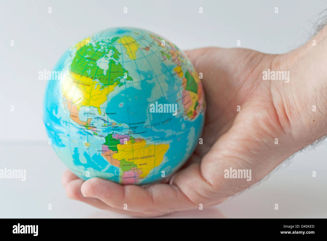 Globe in hands Stock Photo - Alamy