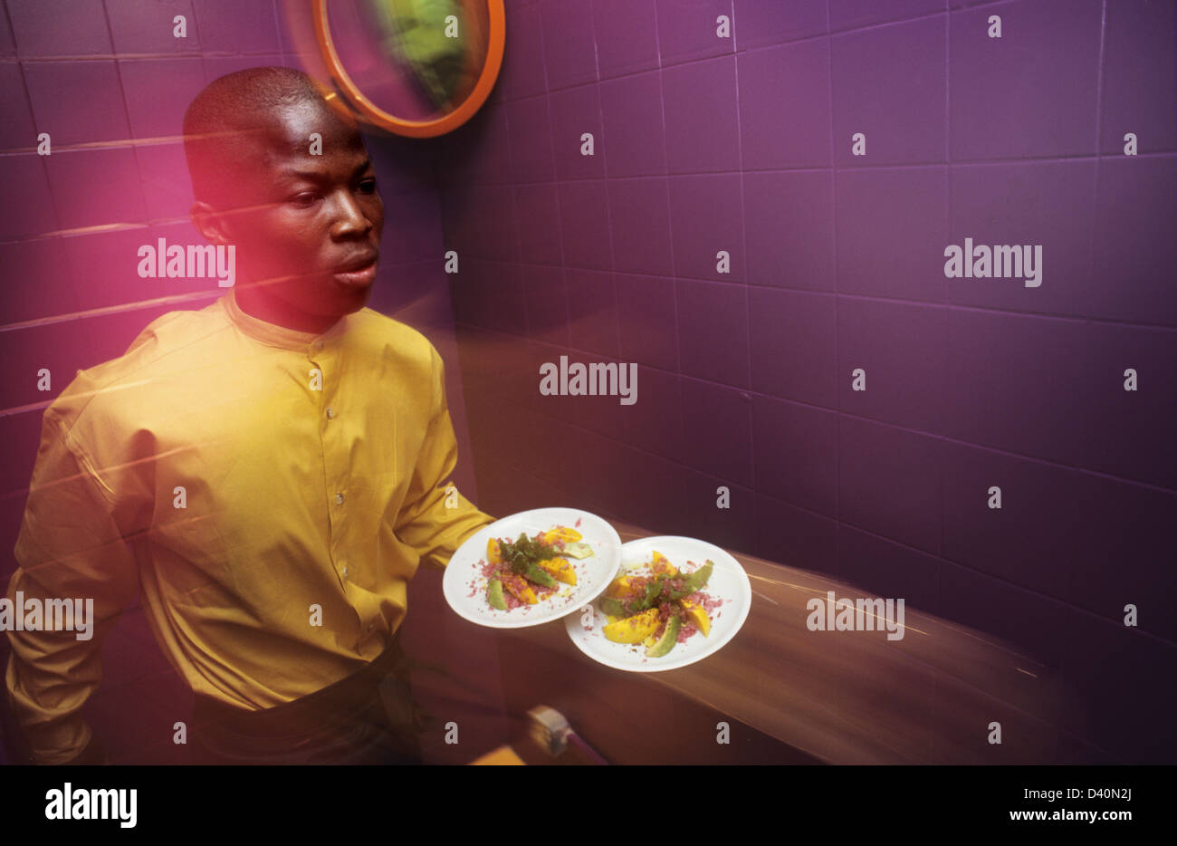 A fast moving waiter in a London restaurant Stock Photo - Alamy