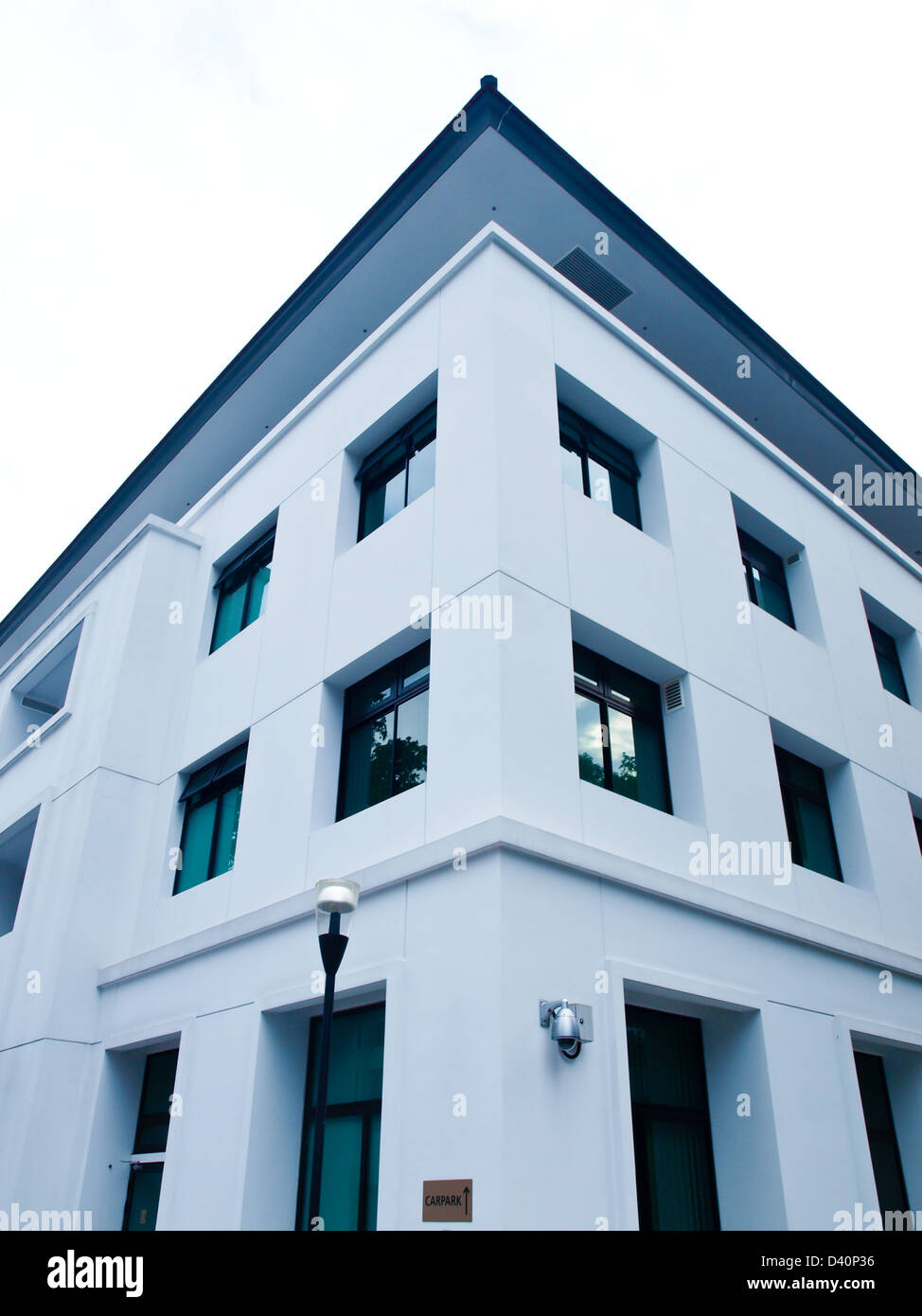 A white modern office building corner Stock Photo - Alamy