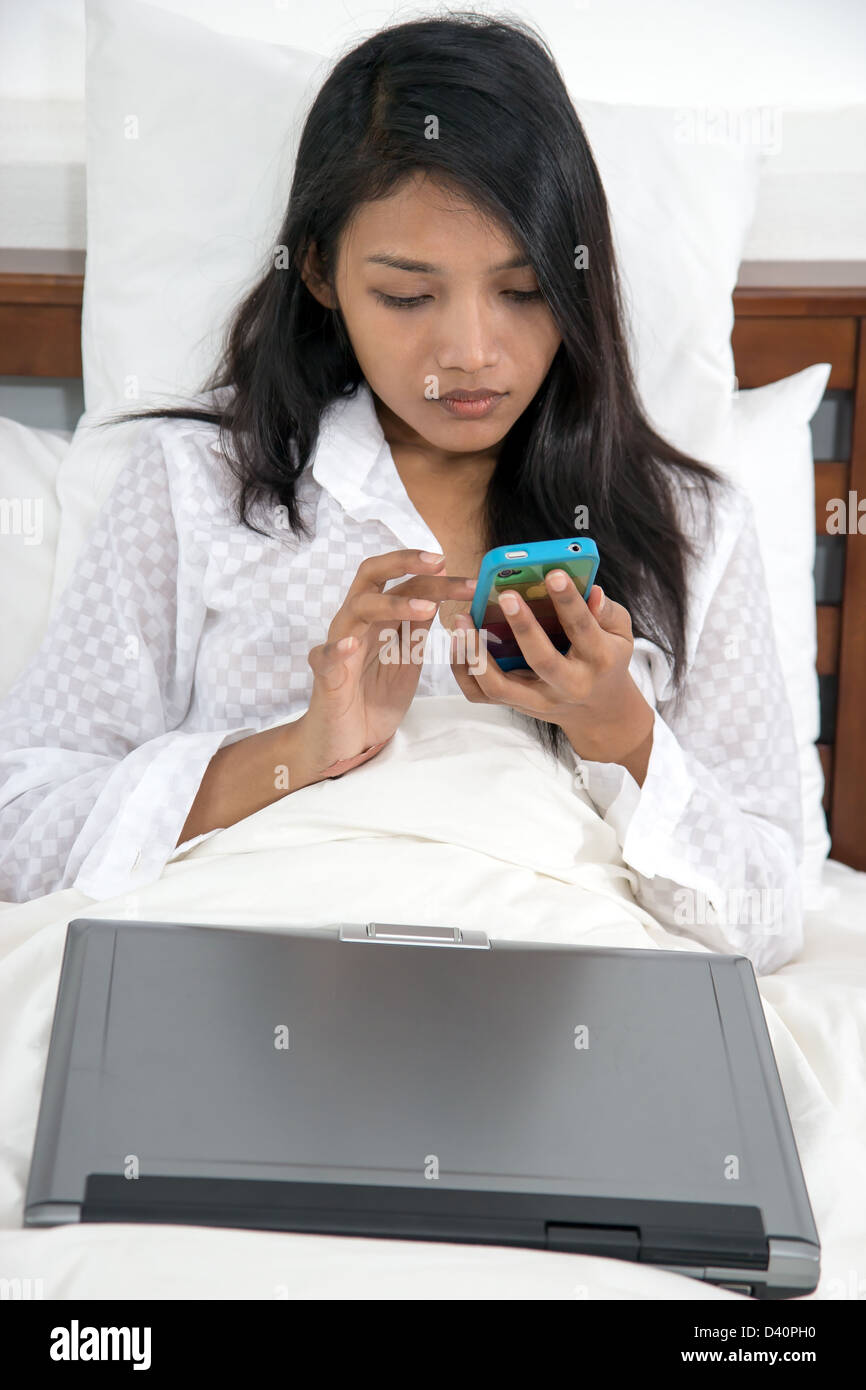 electronic communication in bed Stock Photo - Alamy