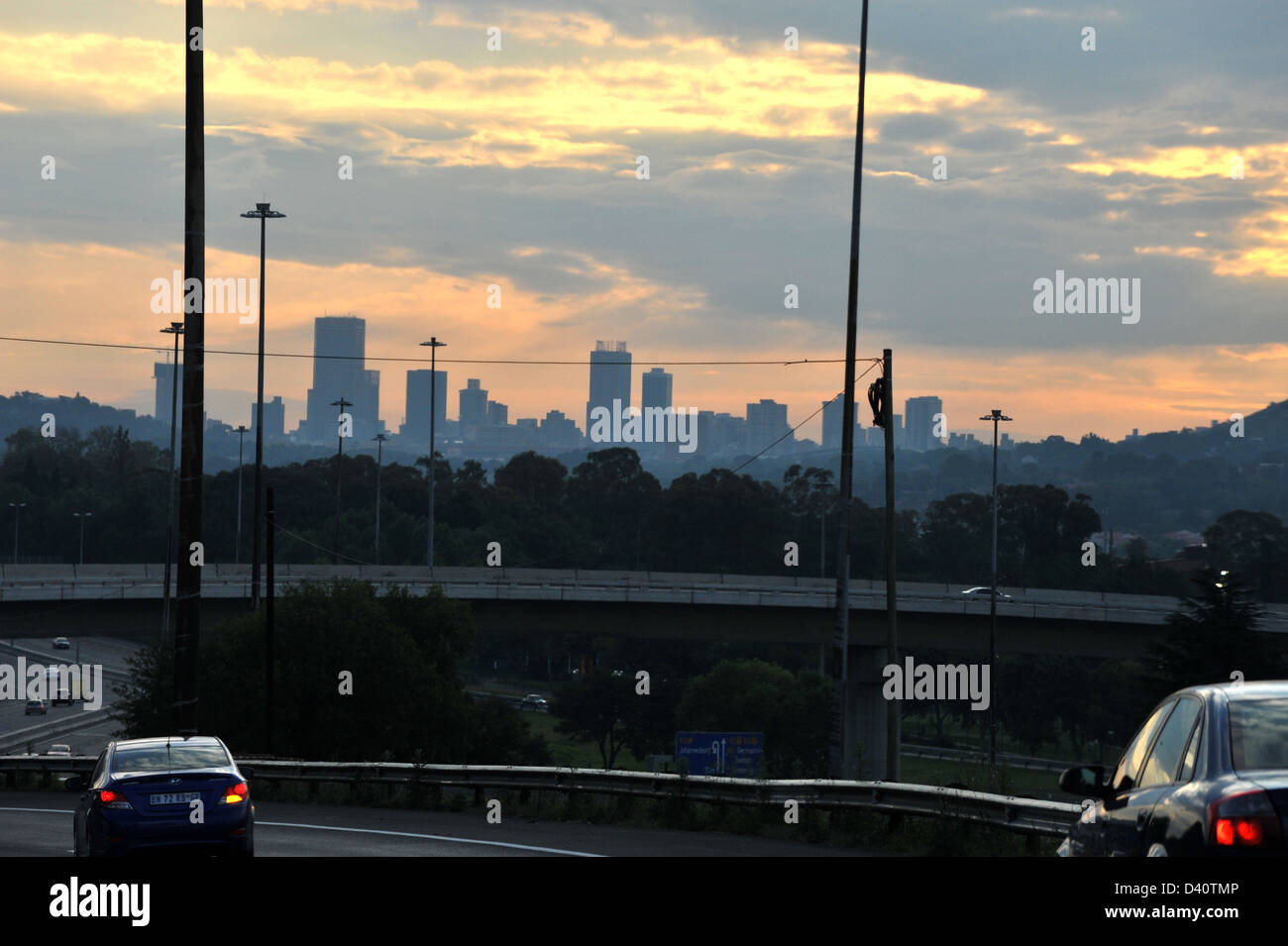 Traffic moving with the Johannesburg skyline in the background Stock ...