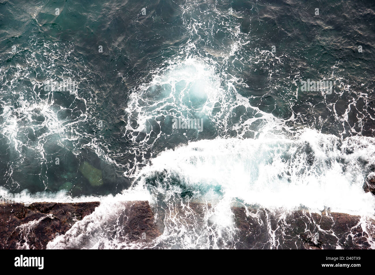 Splashing waves against rocks from hi-res stock photography and images ...