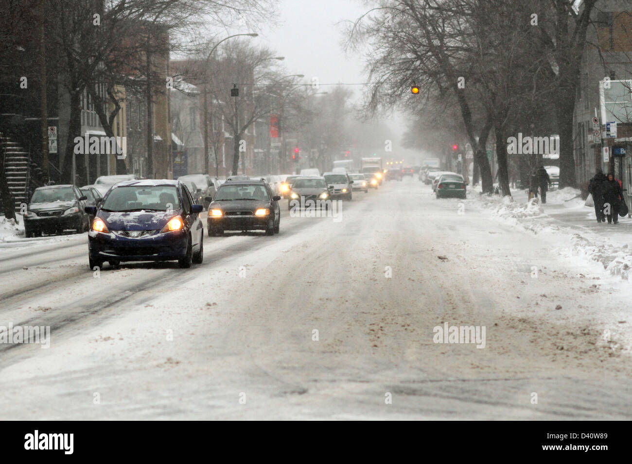 Slippery road conditions causing slow moving traffic in Montreal ...