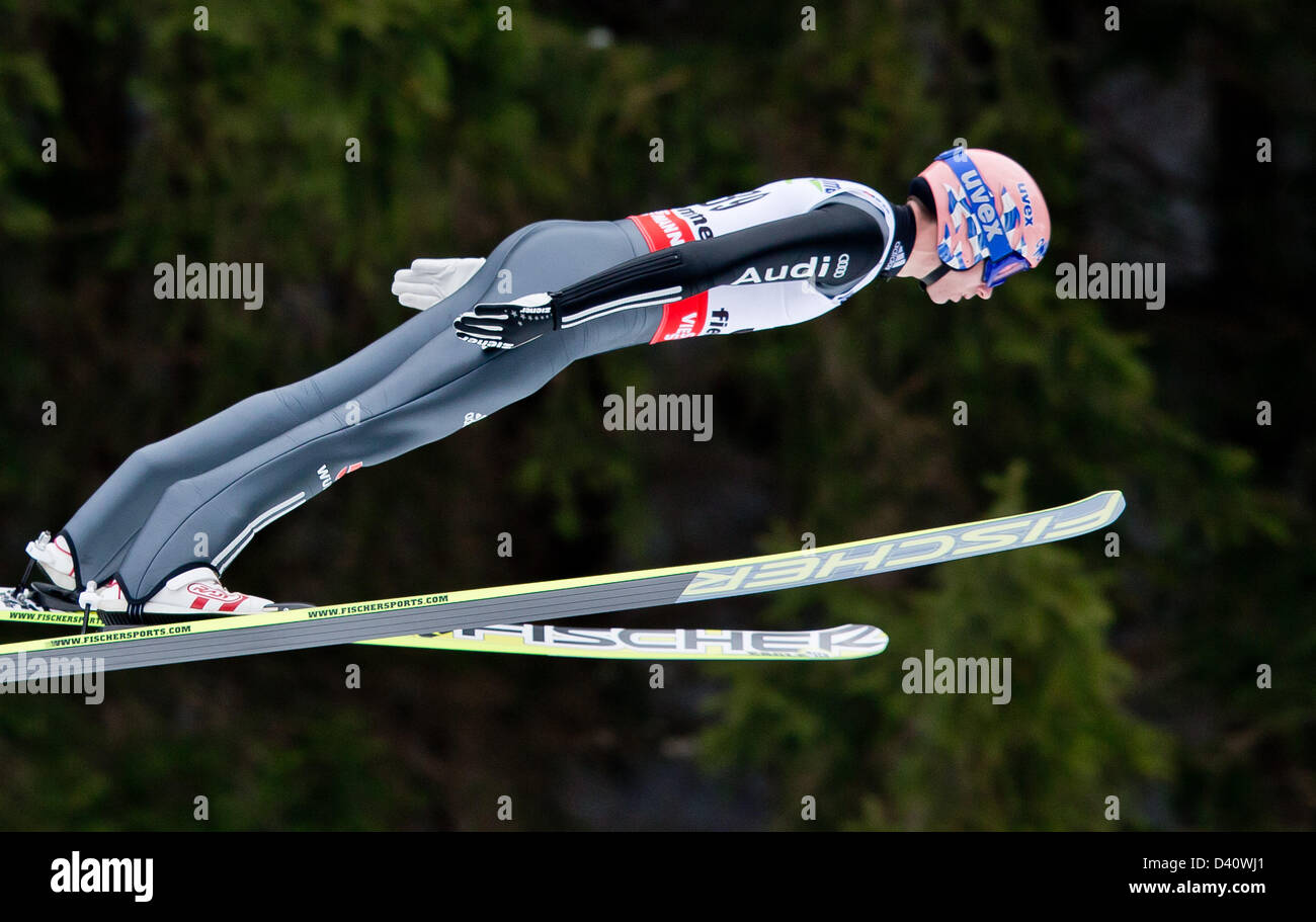 Michael Neumayer of Germany soars through the air during a trial jump ...