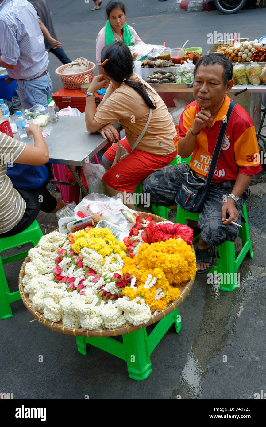 Thai man selling flowers hi-res stock photography and images - Alamy