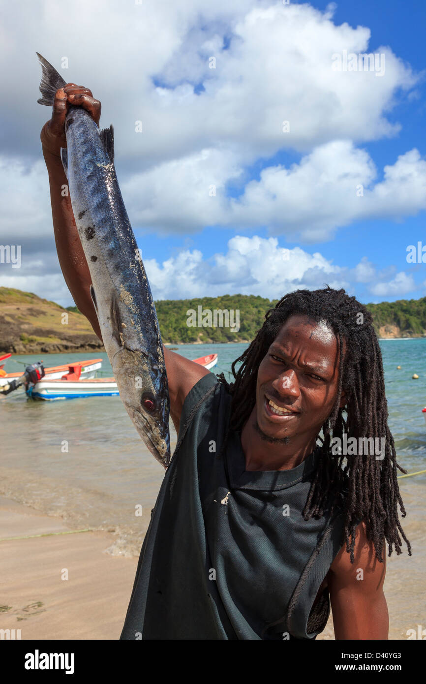 Local fisherman with fish from a fresh catch at Savannes Bay, St Lucia ...