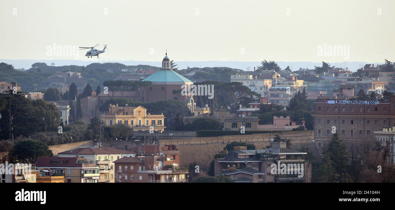 The helicopter carrying Pope Benedict XVI flies past St. Peter's ...