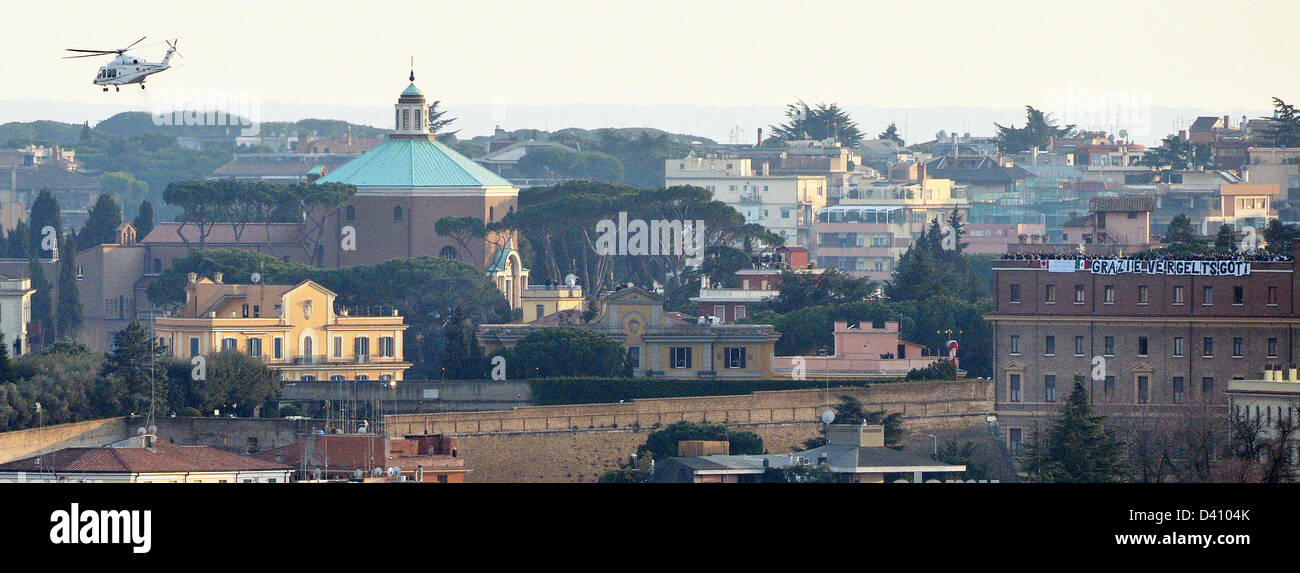 The helicopter carrying Pope Benedict XVI takes off from the helicopter ...