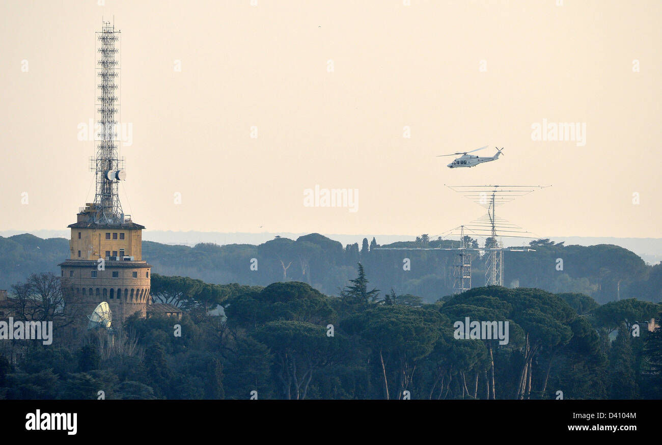 The helicopter carrying Pope Benedict XVI flies past St. Peter's ...