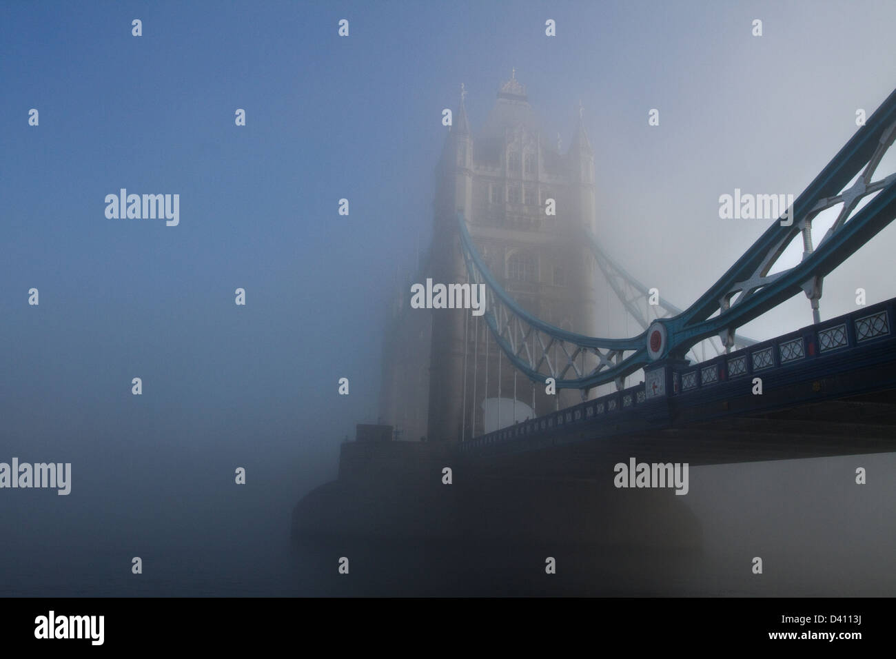 A picture shows Tower bridge through heavy fog and low cloud in London ...