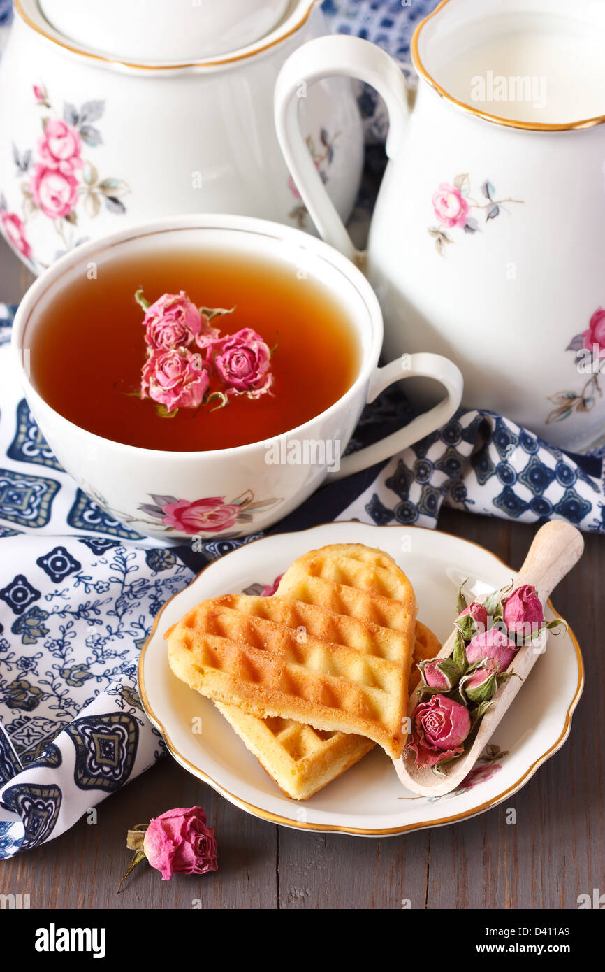 Cup of tea, fresh milk and Belgian waffles for breakfast Stock Photo ...