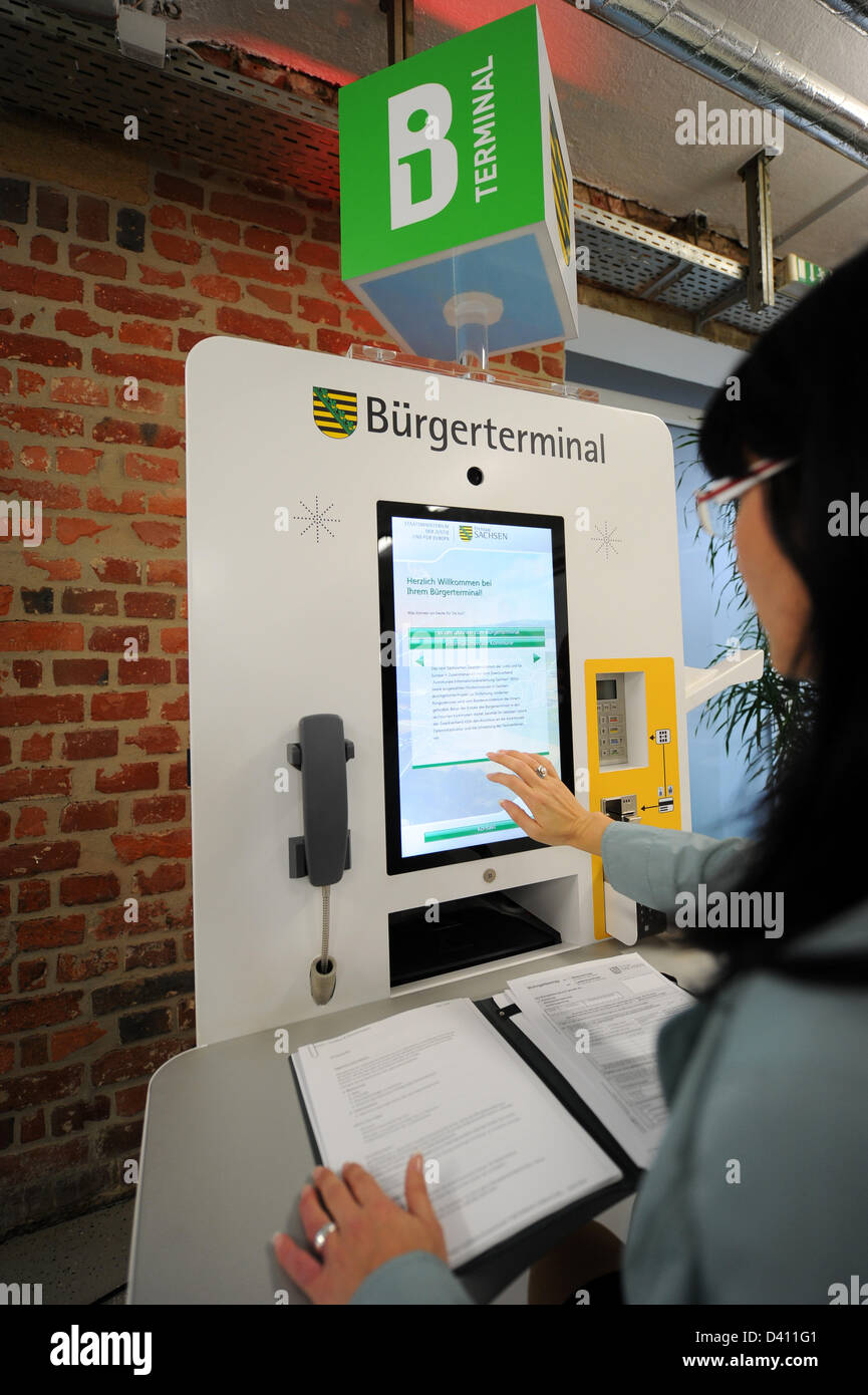 A woman uses the new citizens' terminal in the production rooms of the ...