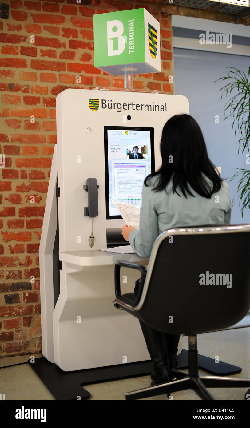 A woman uses the new citizens' terminal in the production rooms of the ...