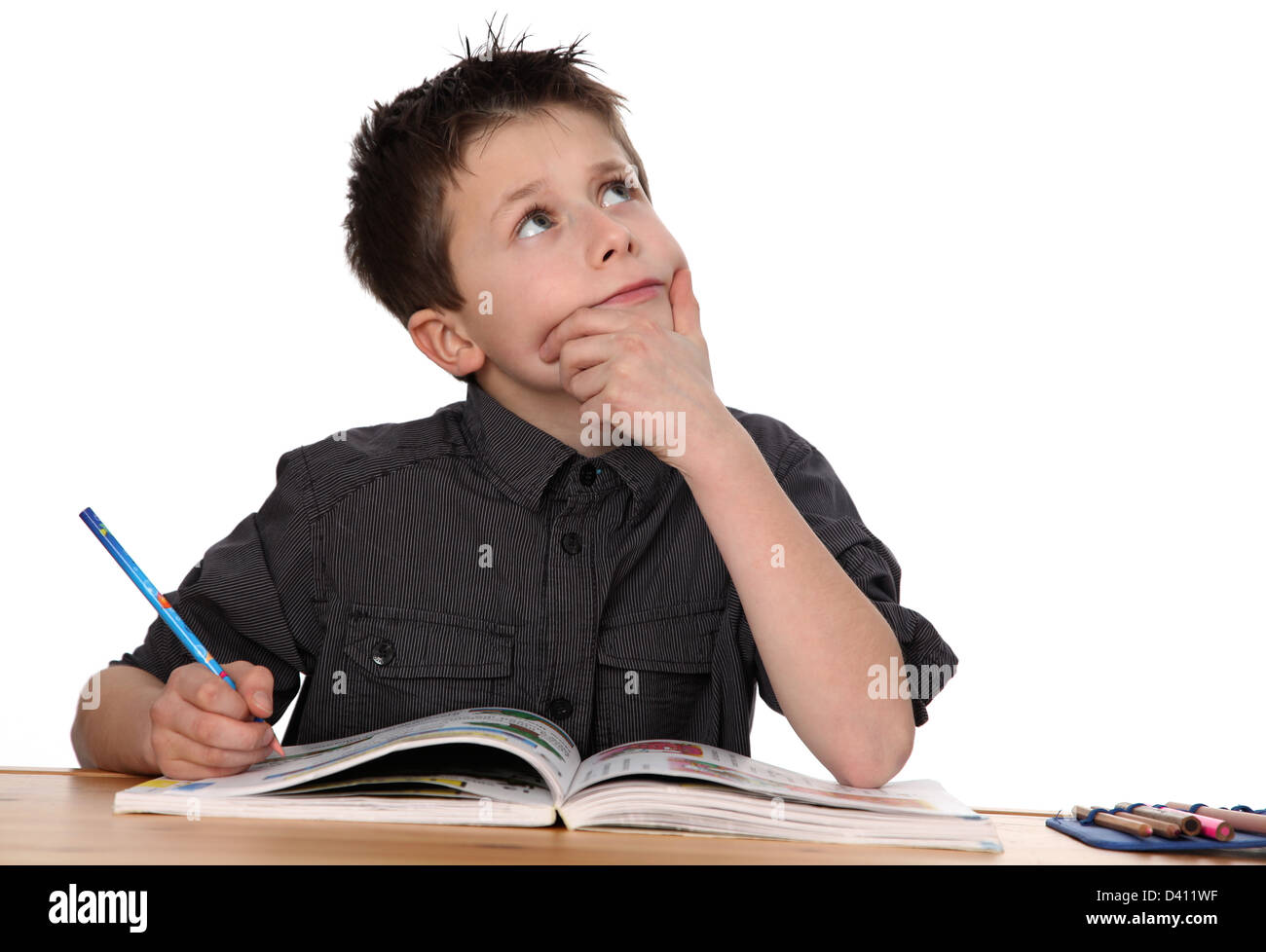 cute young boy learning with white background Stock Photo - Alamy