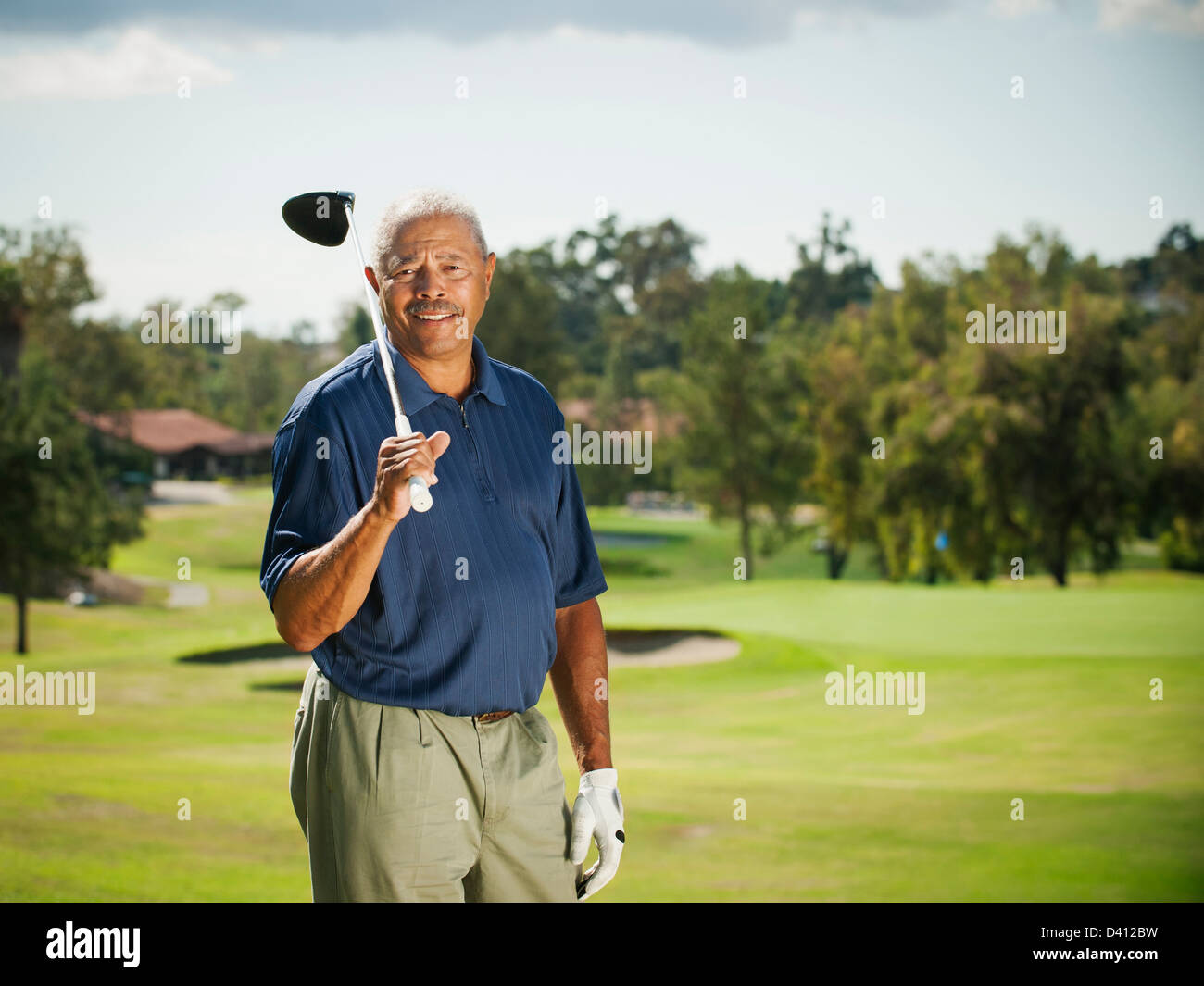Black man playing golf Stock Photo - Alamy