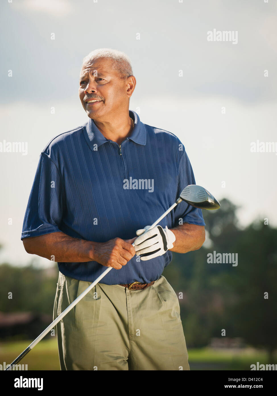 African man holding golf club hi-res stock photography and images - Alamy