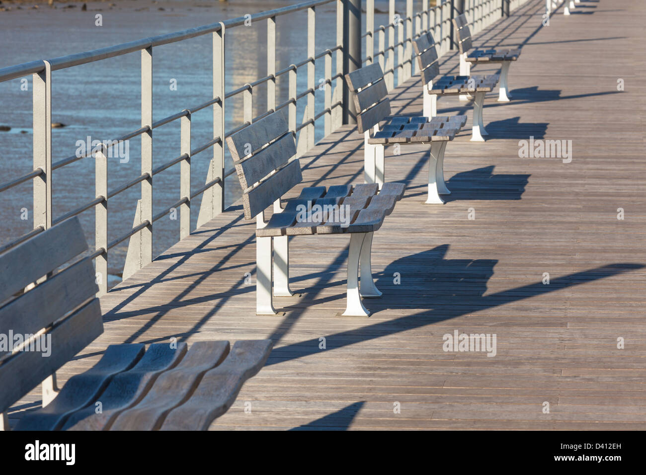 Wooden Benches Row at River Embankment. Horizontal shot Stock Photo - Alamy