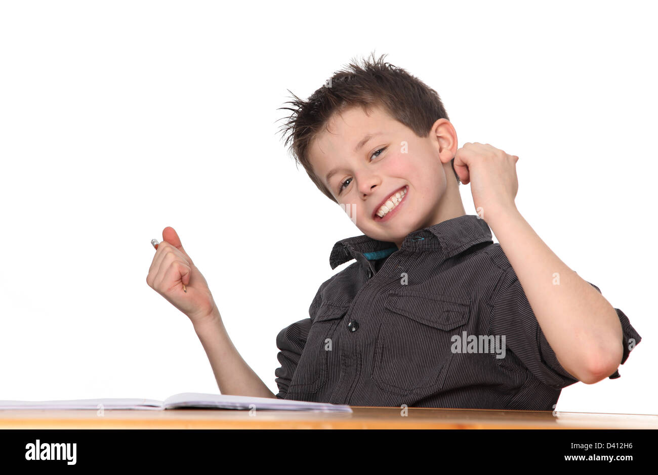 cute young boy doing homework Stock Photo - Alamy