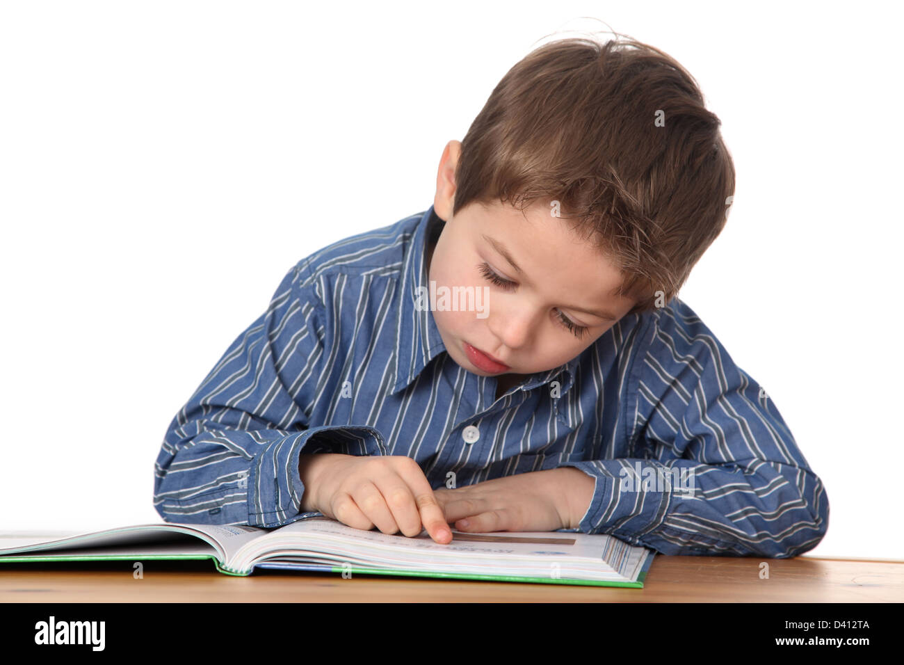 cute young boy doing homework Stock Photo - Alamy