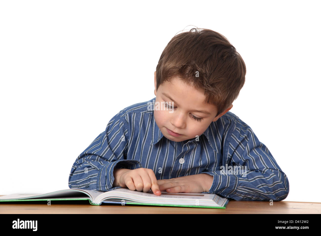cute young boy doing homework Stock Photo - Alamy