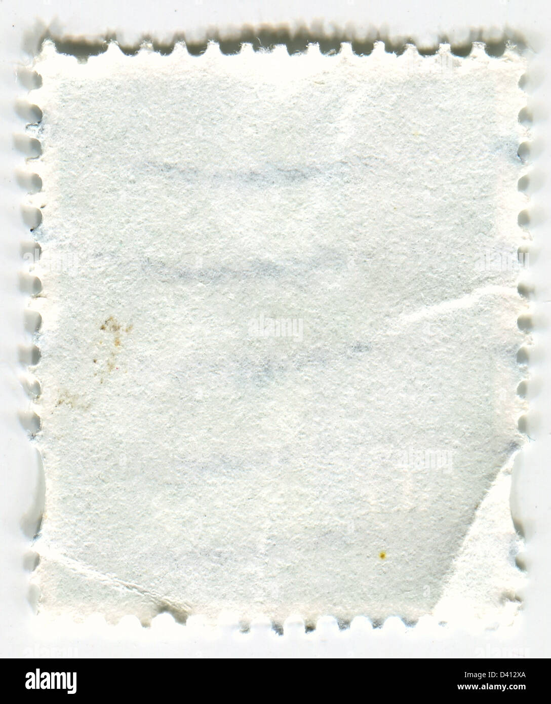 The reverse side of a postage stamp Stock Photo - Alamy