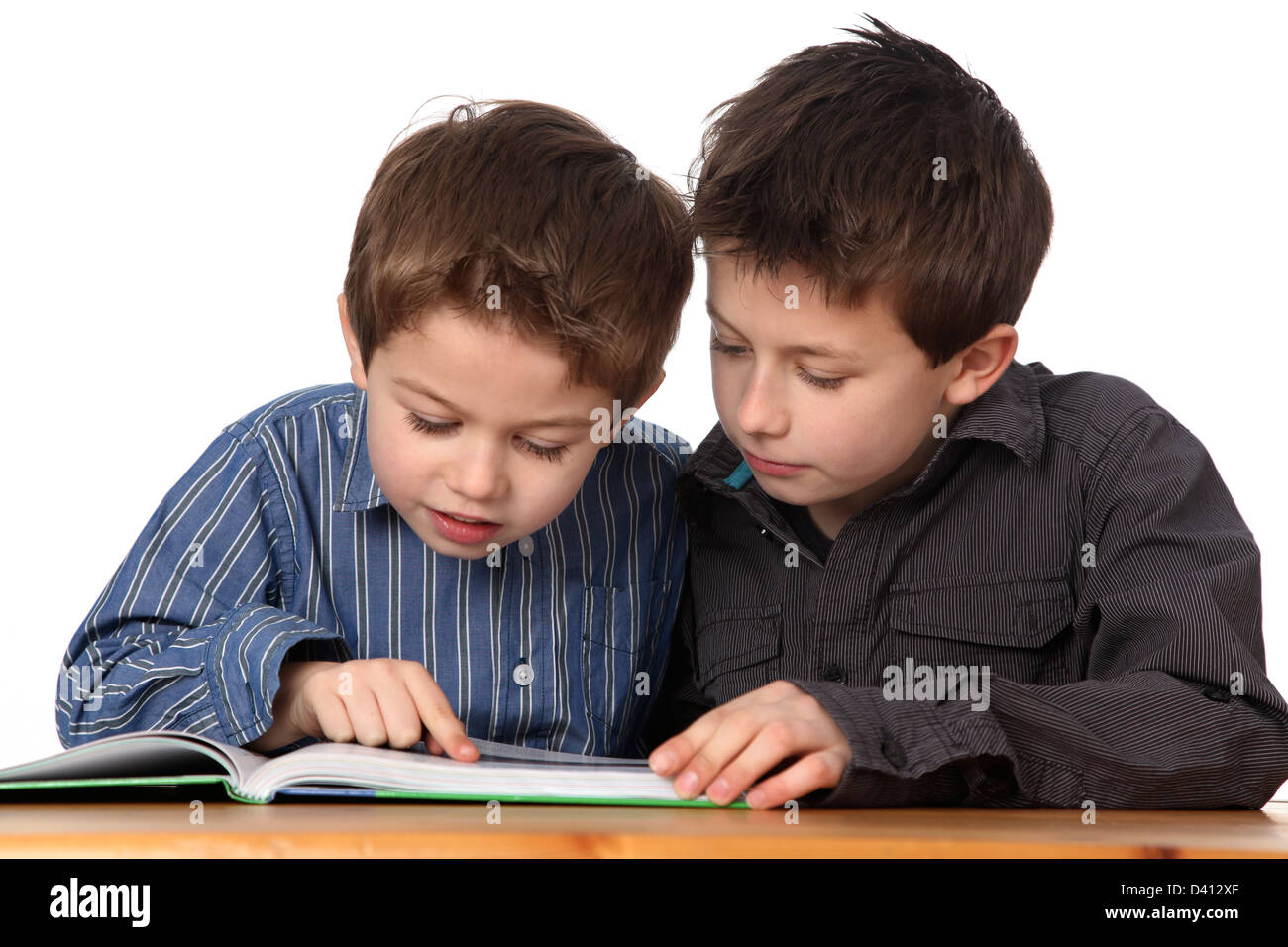 two cute young boys learning together Stock Photo - Alamy