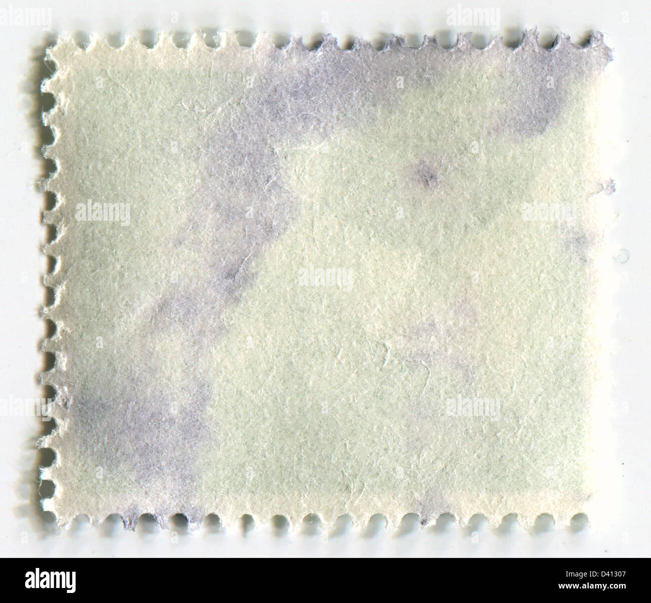 The reverse side of a postage stamp Stock Photo - Alamy