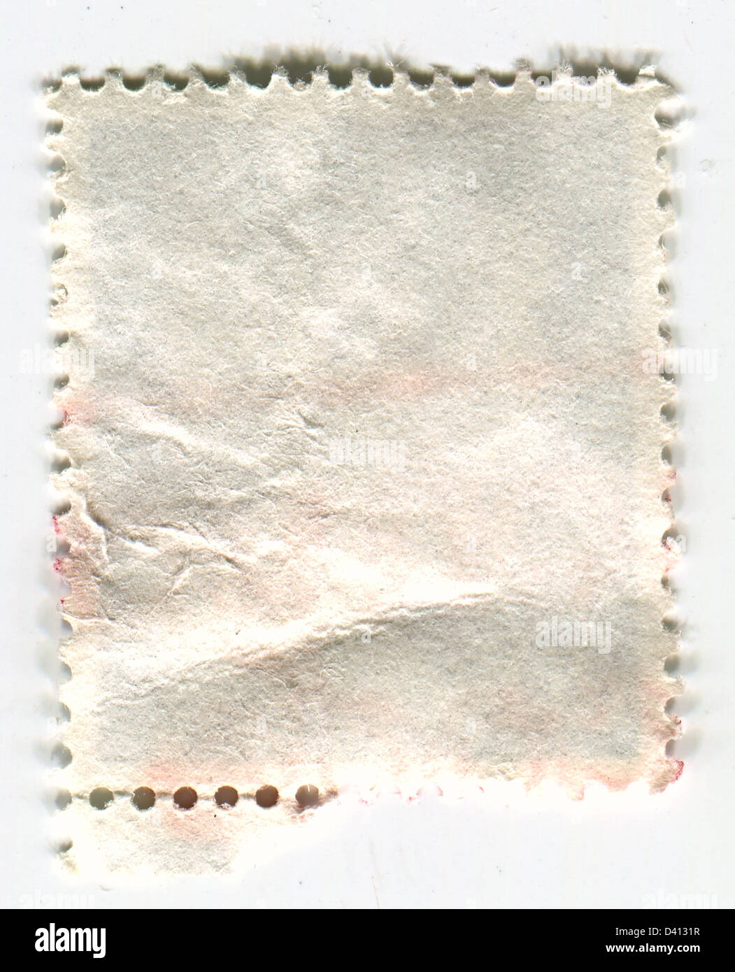 The reverse side of a postage stamp Stock Photo - Alamy