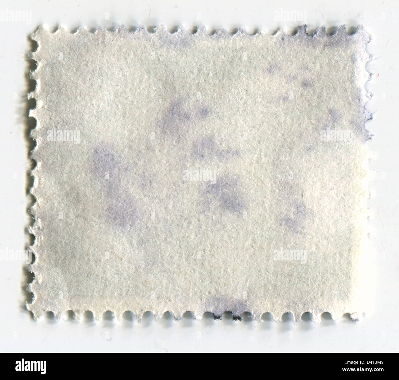 The reverse side of a postage stamp Stock Photo - Alamy