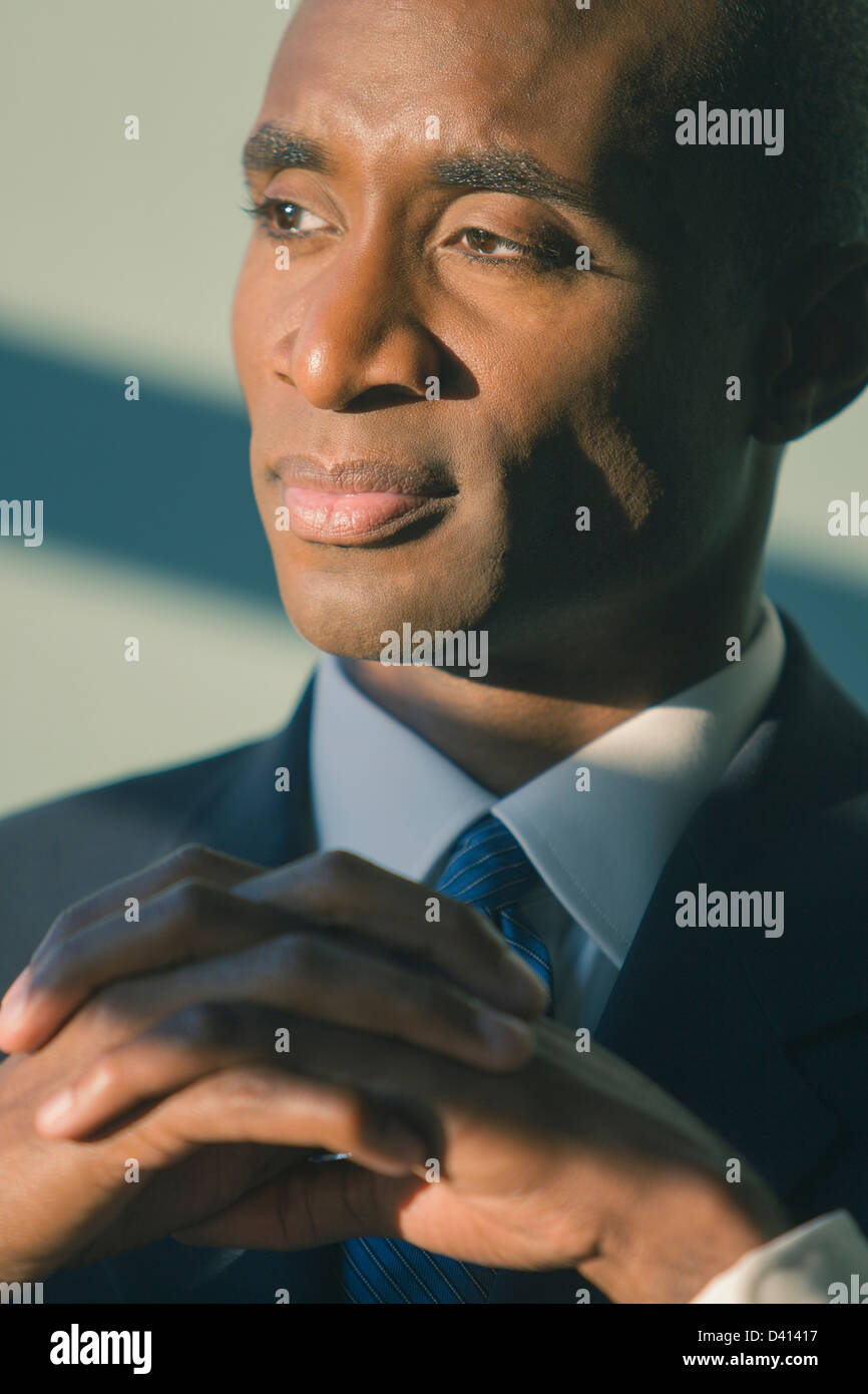 Man sitting hand folding hi-res stock photography and images - Alamy
