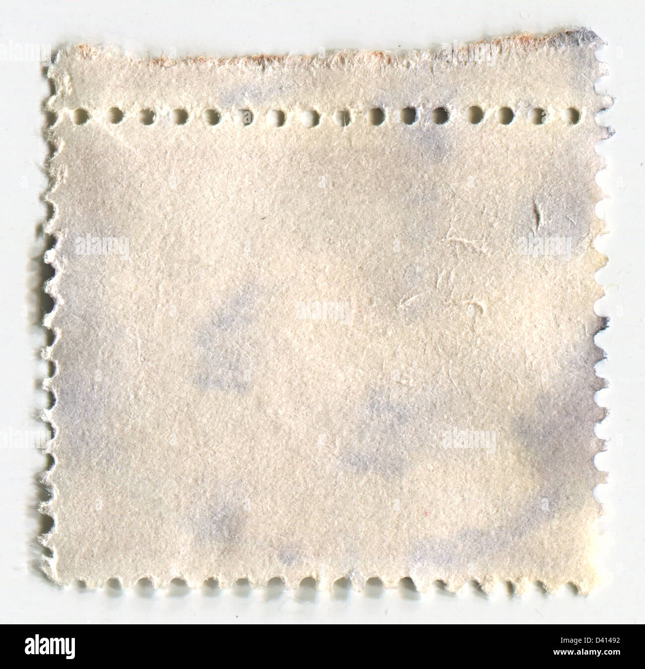 The reverse side of a postage stamp Stock Photo - Alamy