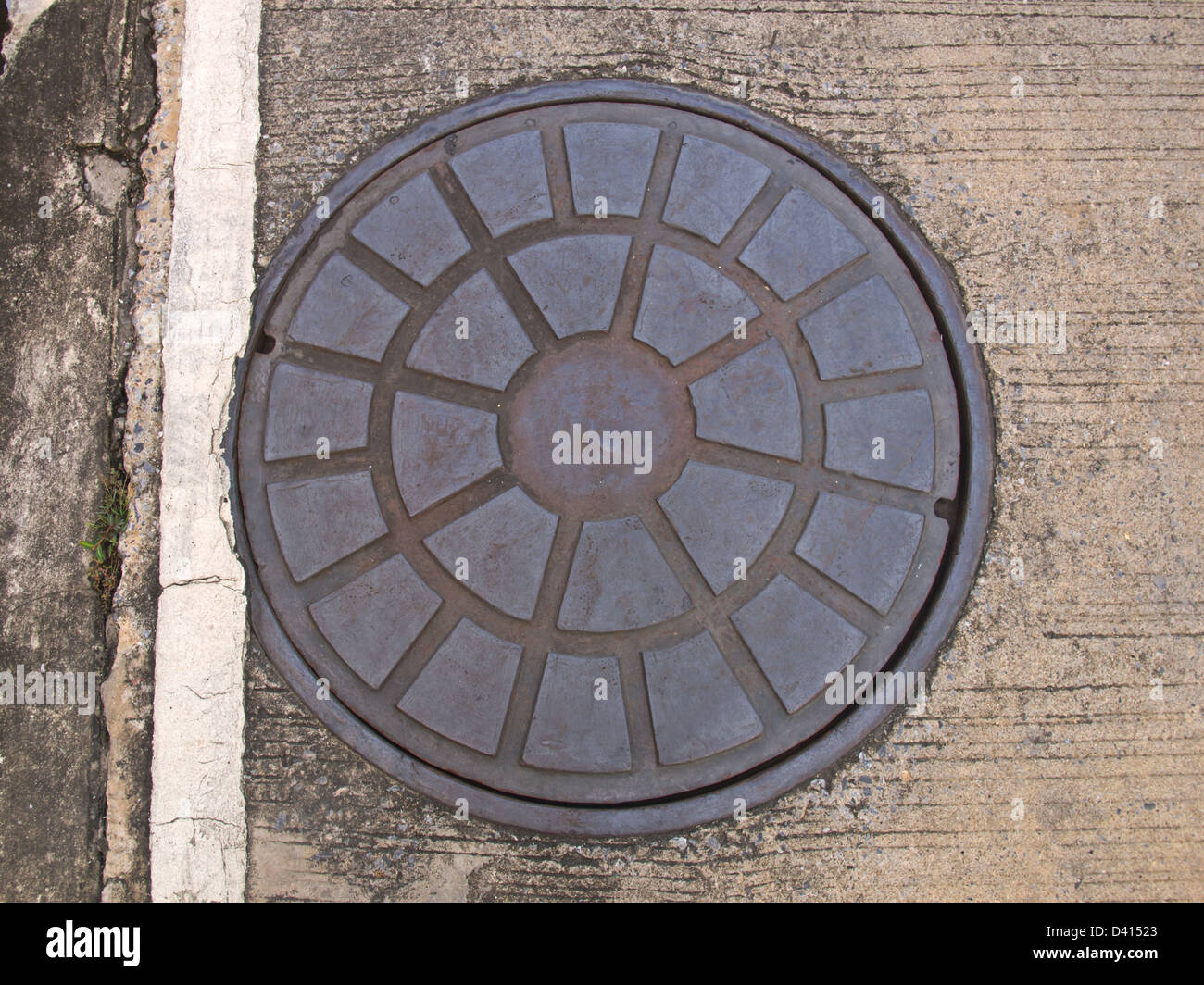 Rusty steel manhole cover Stock Photo - Alamy