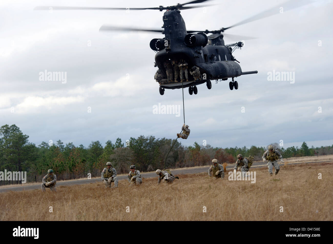 US Green Beret Special Forces soldiers fast rope out of a CH-47 Chinook ...